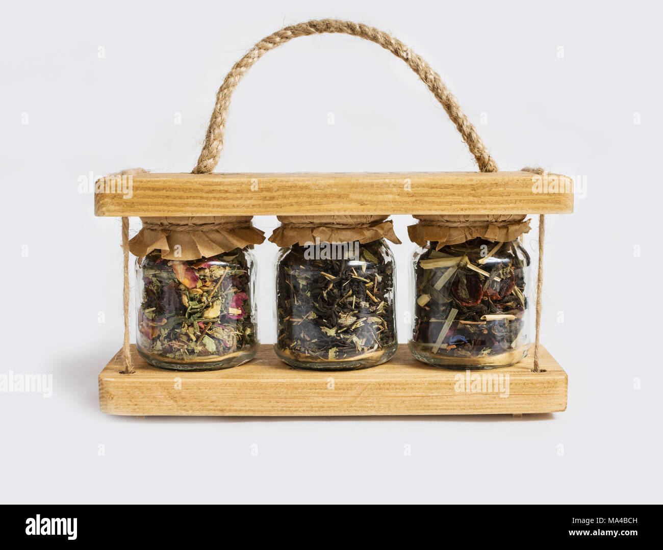 Tea set in glass jars isolated on white background Stock Photo - Alamy