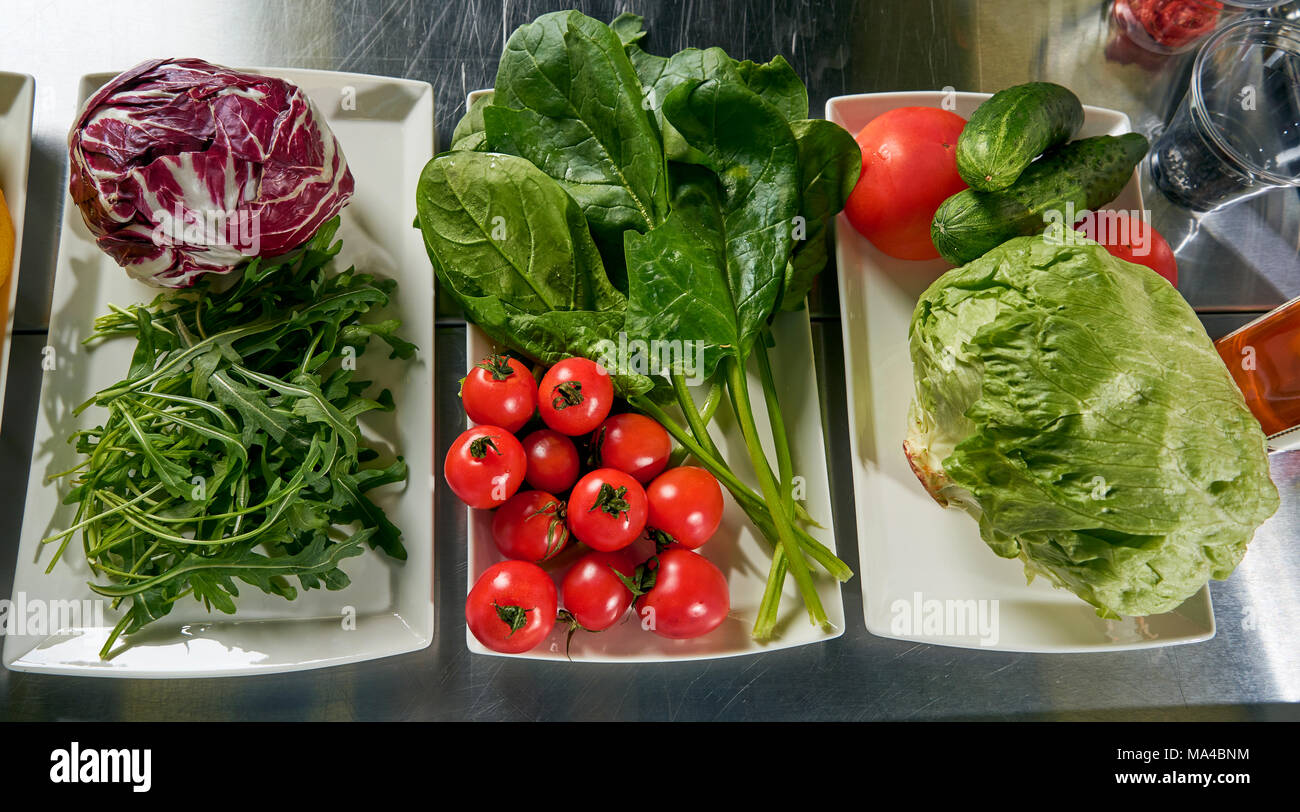 vegetables in the professional kitchen table Stock Photo - Alamy