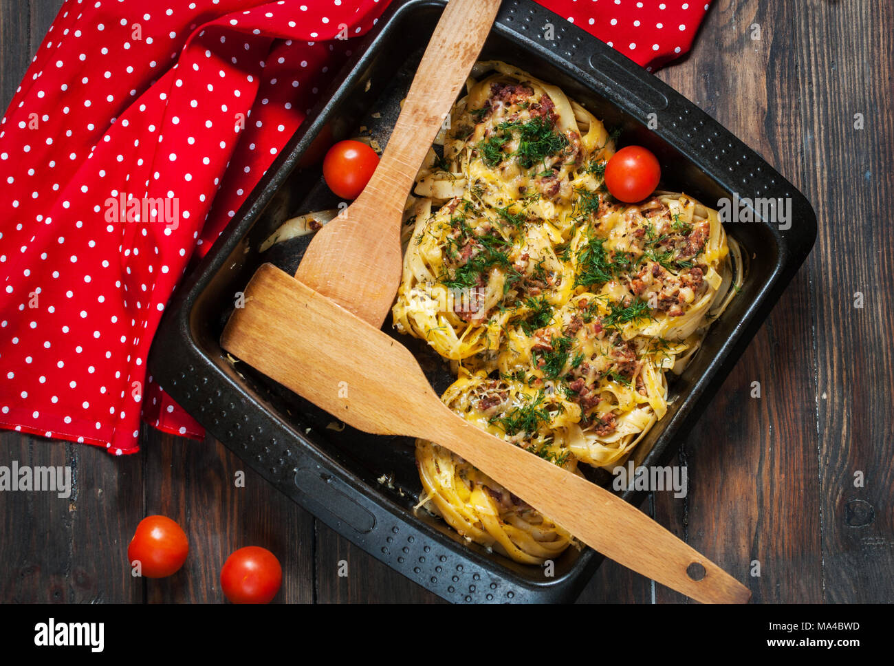 Baked rolled pasta with forcemeat and cheesy tomato sauce Stock Photo ...