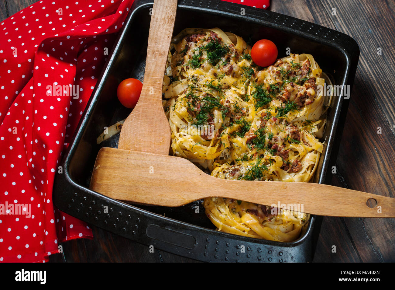Baked rolled pasta with forcemeat and cheesy tomato sauce Stock Photo ...