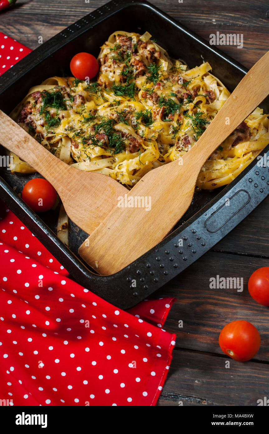 Baked rolled pasta with forcemeat and cheesy tomato sauce Stock Photo ...