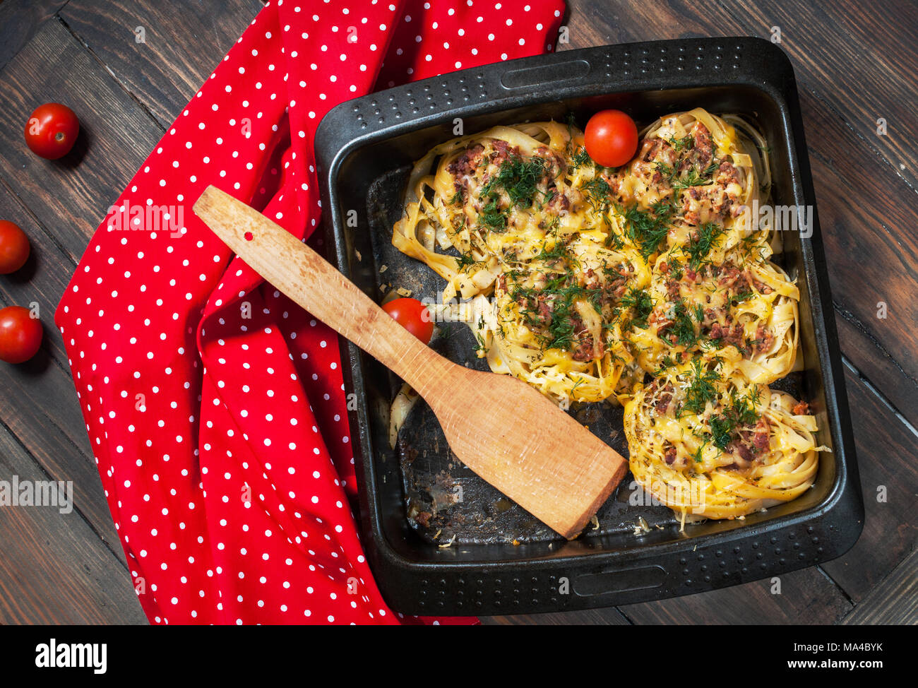 Baked rolled pasta with forcemeat and cheesy tomato sauce Stock Photo ...