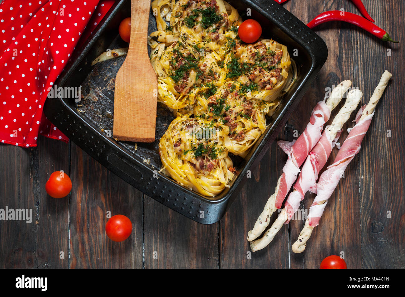 Baked rolled pasta with forcemeat and cheesy tomato sauce Stock Photo ...