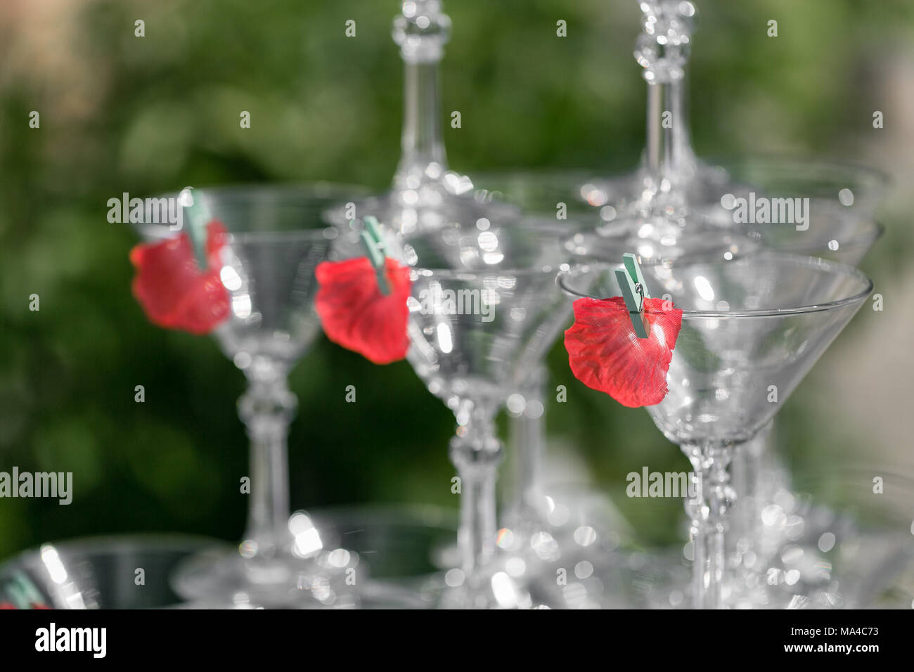 Champagne glass pyramid on wedding party. Tower of glasses of wine ...