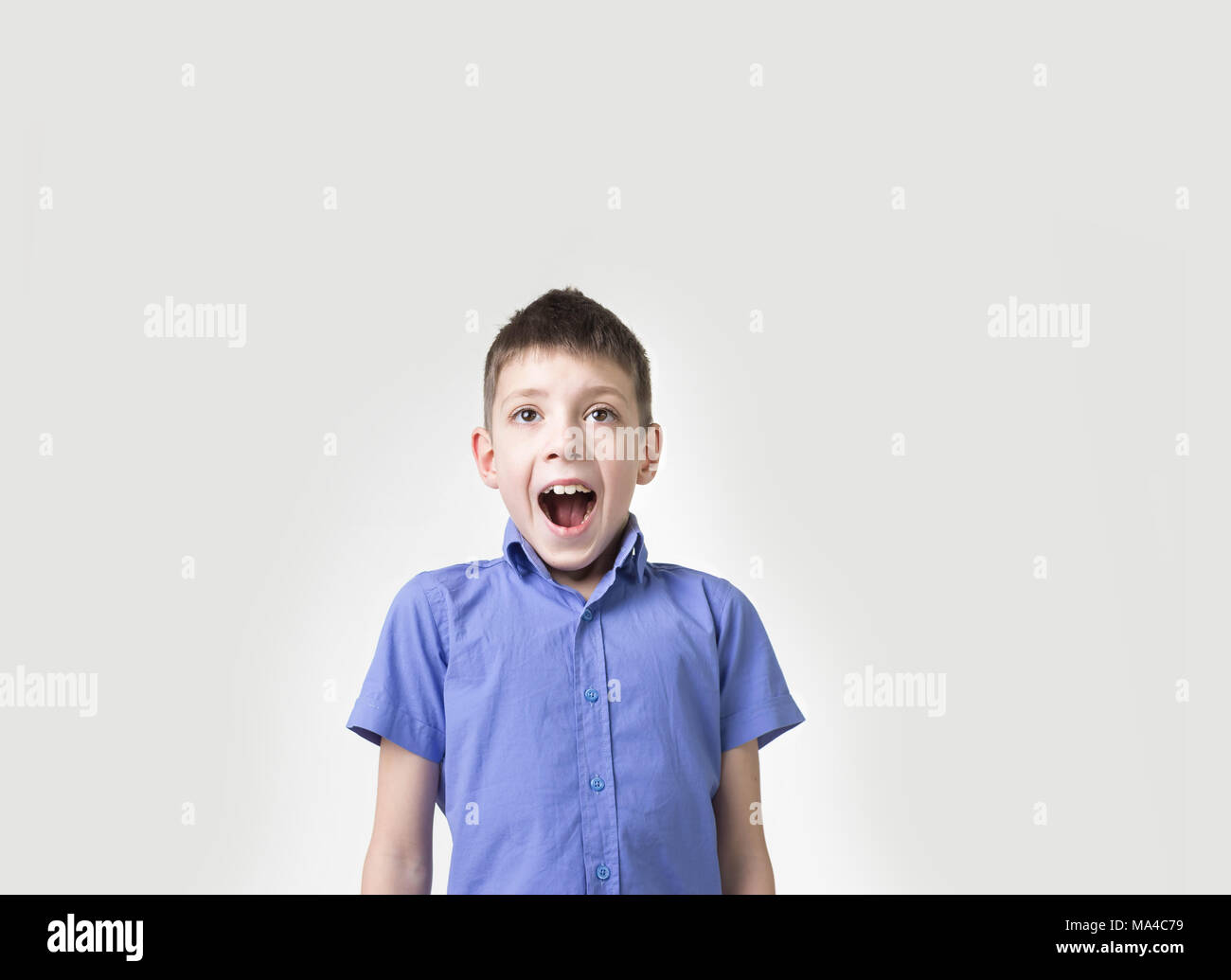 Emotional portrait of irritated shouting teen boy. Surprised teenager ...