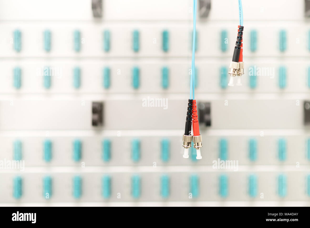 Fiber optic connectors with patch-panel on the background, server room ...