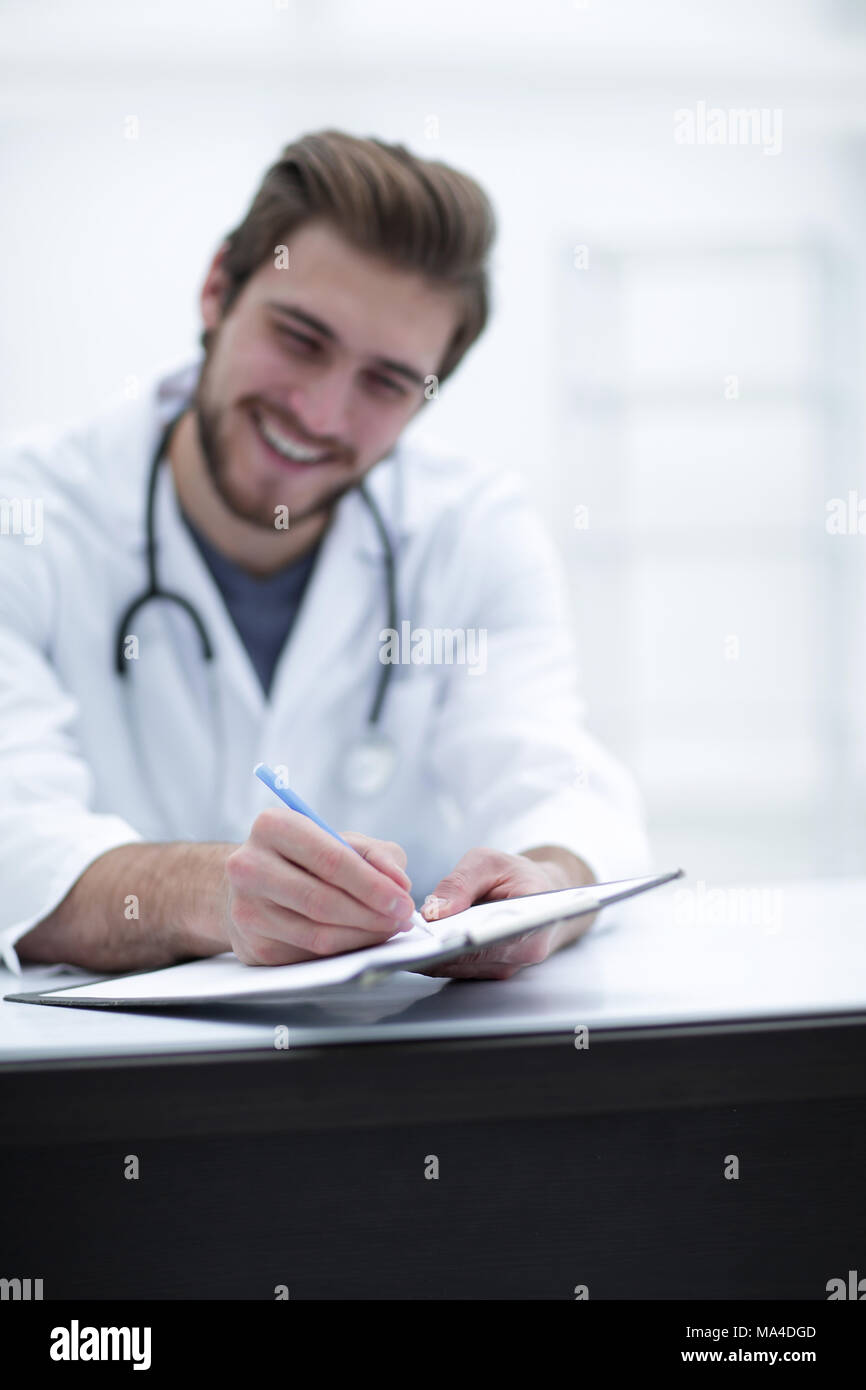 Doctor writing out medical recipe hi-res stock photography and images ...