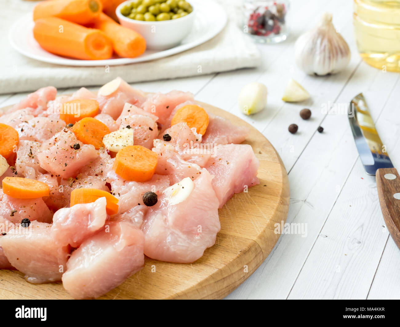 Sliced chicken meat for cooking Vegetables on table Stock Photo - Alamy