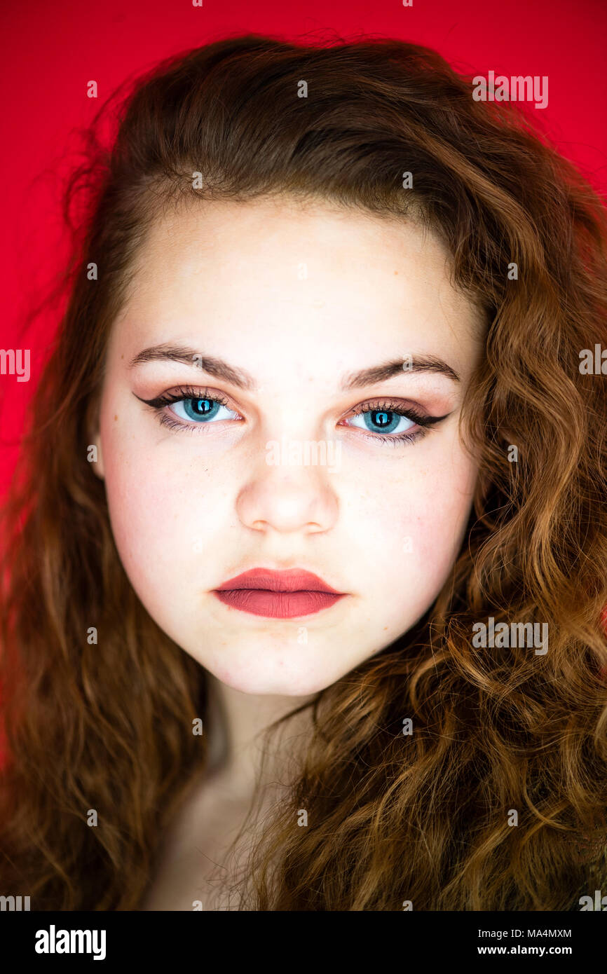 Close up of the face of a moody attrractive young 13 thirteen year old ...