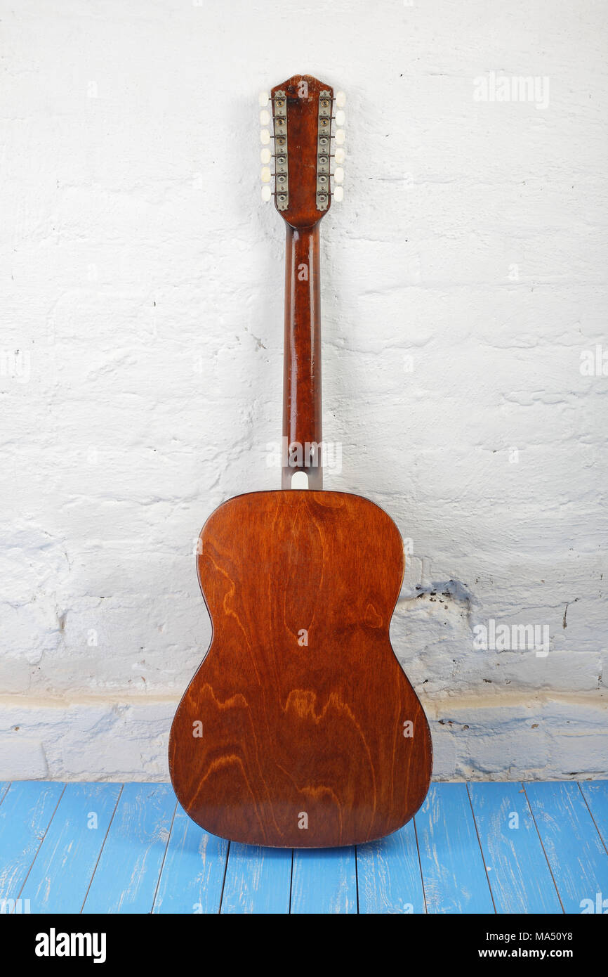 Musical instrument - Back view vintage twelve-string acoustic guitar on ...