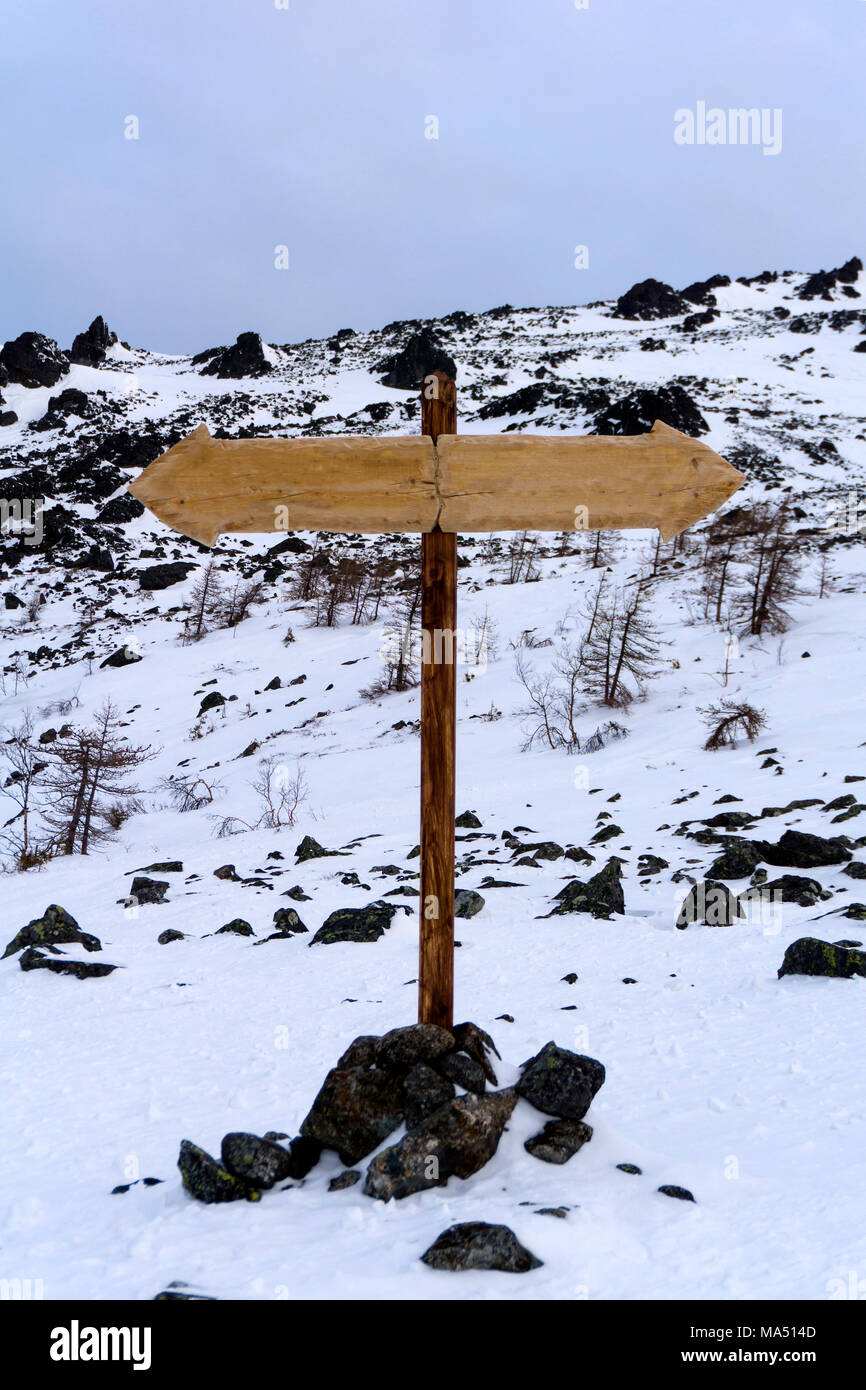 Wooden signpost with arrows in two directions hi-res stock photography ...