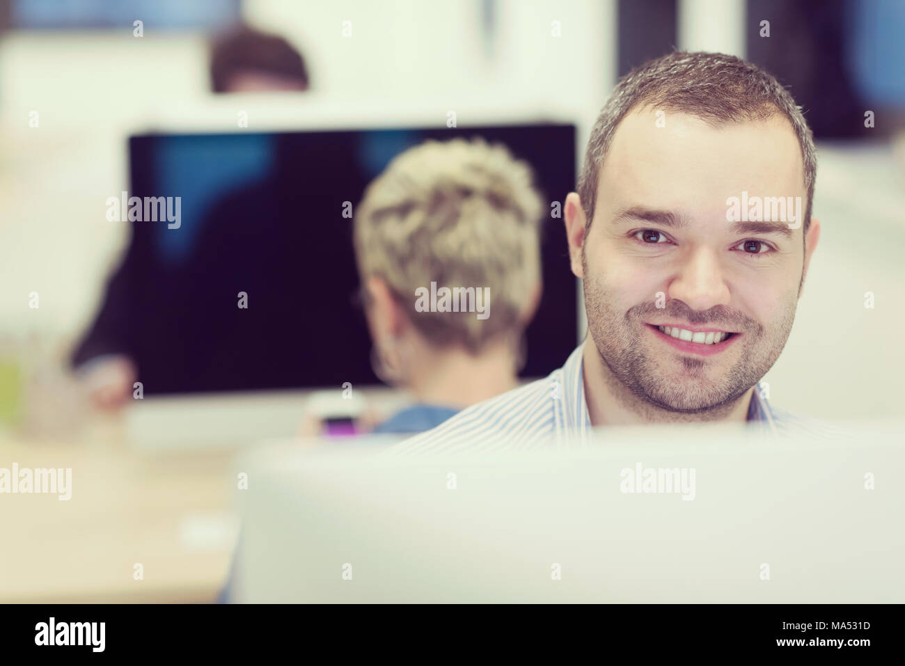 startup business, software developer working on desktop computer at ...