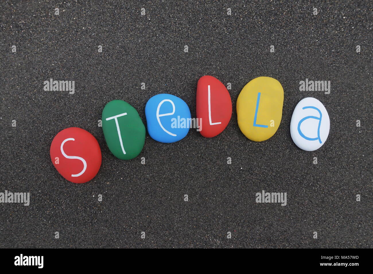 Stella, feminine given name with multicolored stones over black ...