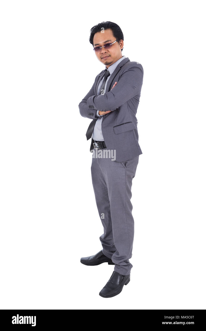 business man in suit with arms crossed isolated on a white background ...