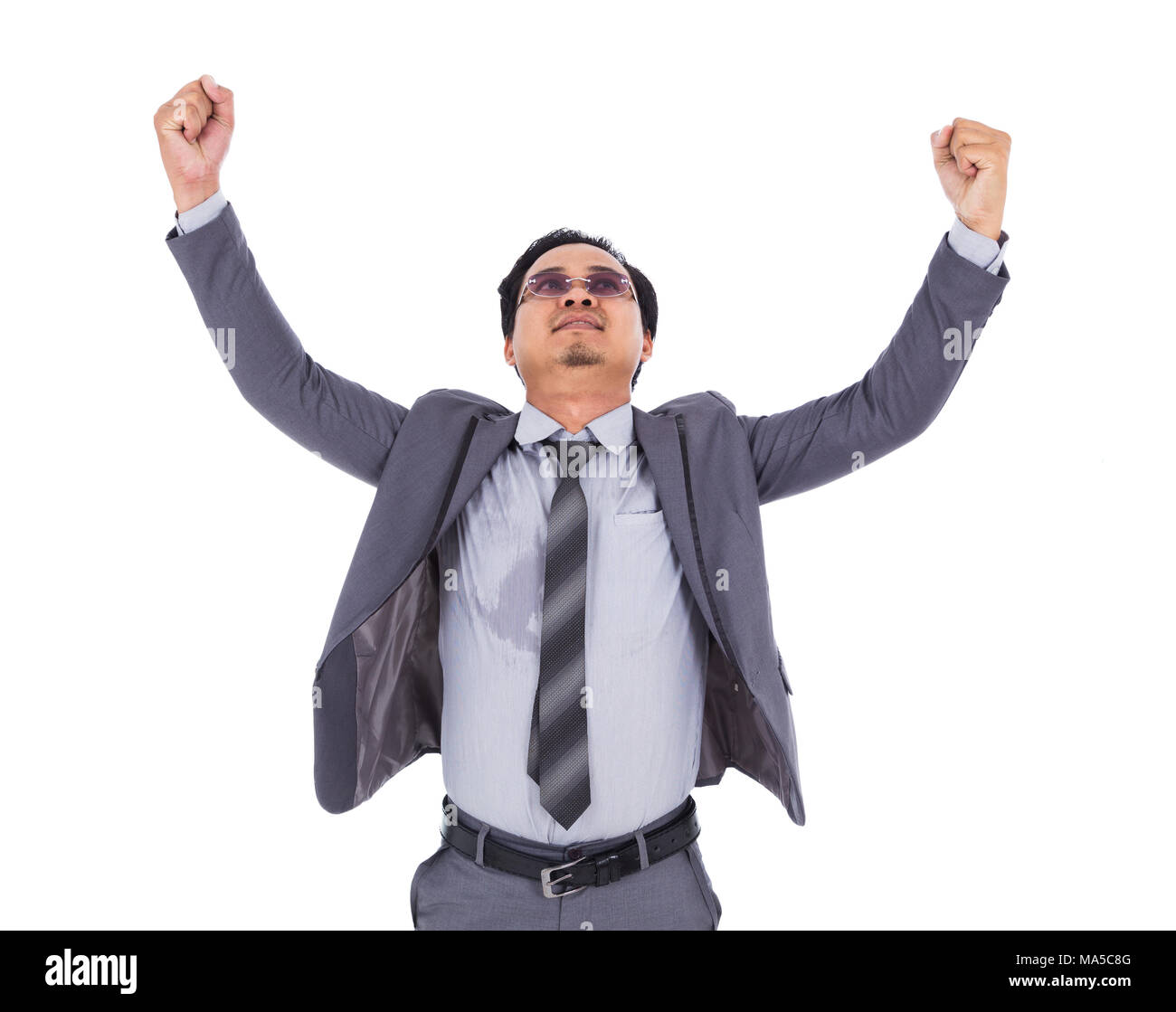 winner business man in suit with arms raised isolated on a white ...