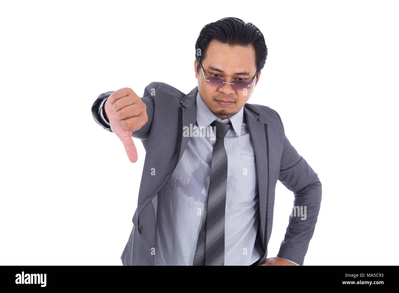 business man in suit with thumb down isolated on a white background ...