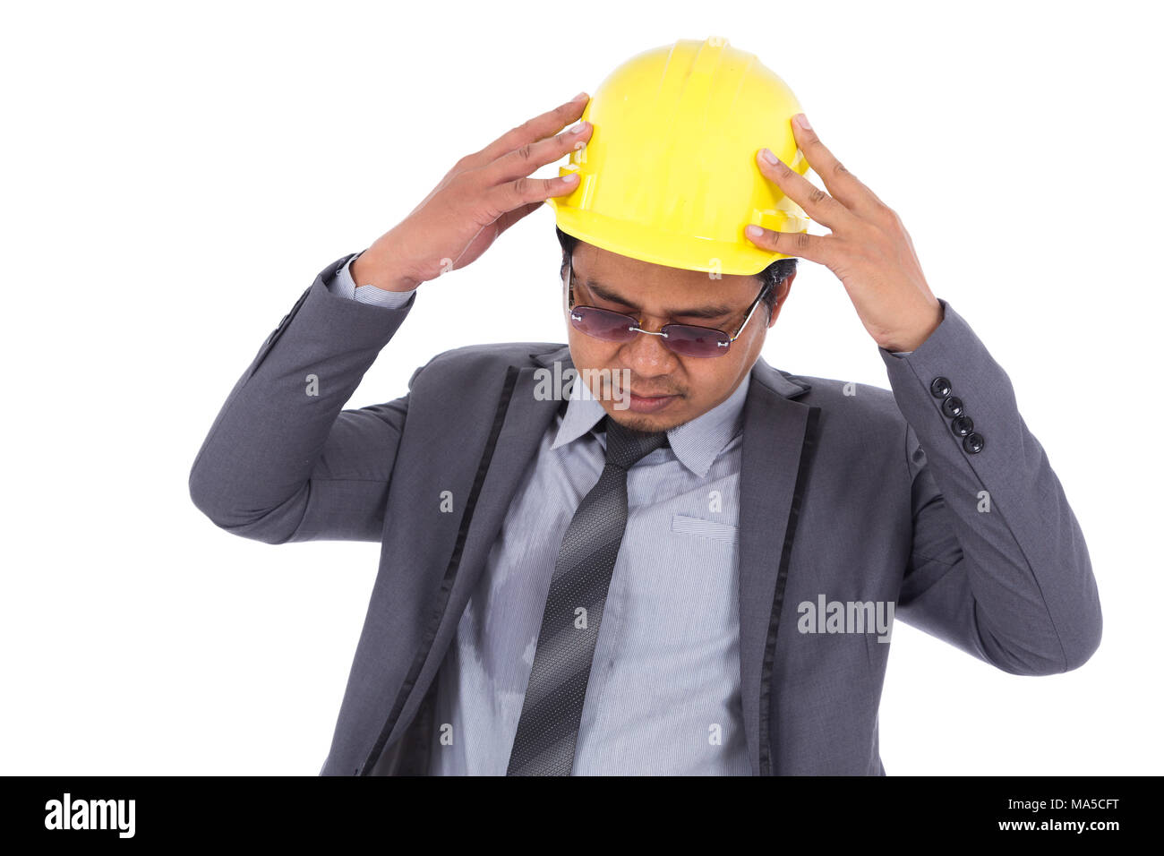 engineer in suit with headache and problems isolated on a white ...