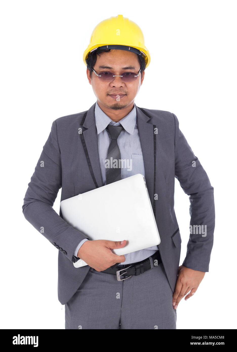 engineer holding laptop isolated on a white background Stock Photo - Alamy