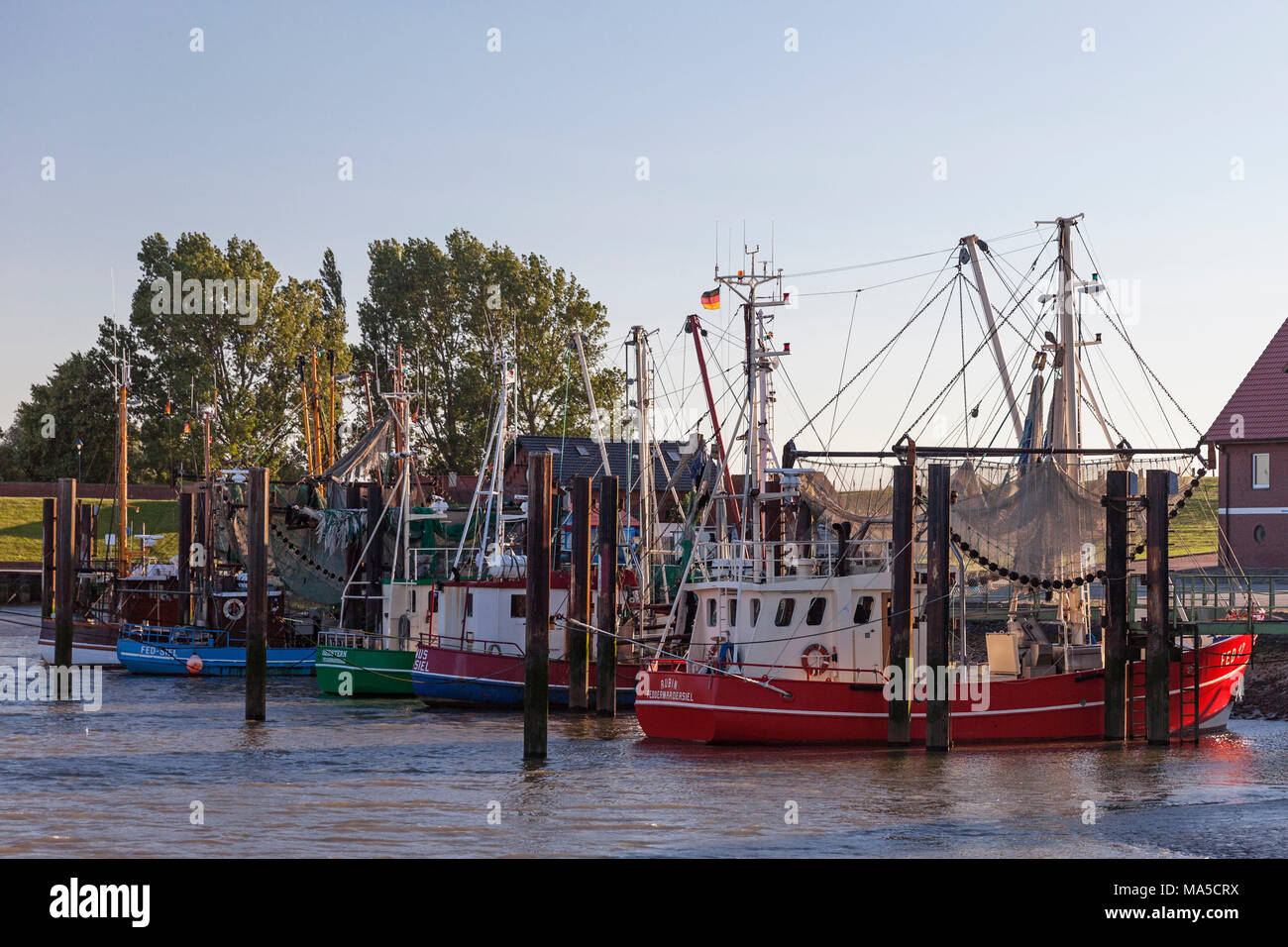 Fishing boat in the port of fedderwardersiel hi-res stock photography ...