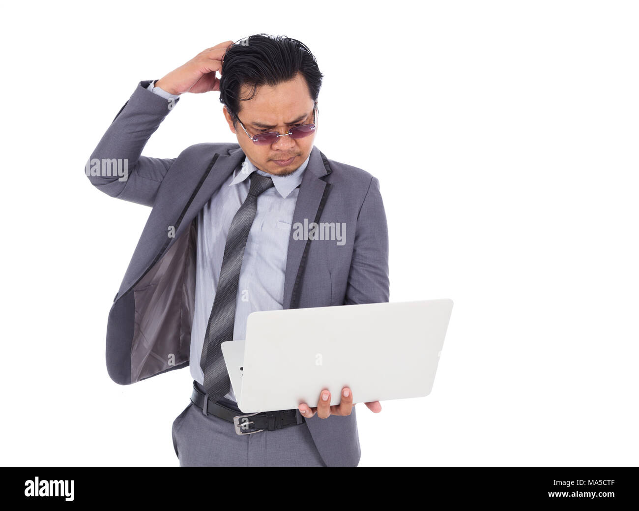 business man with headache and having problems on laptop isolated on a ...