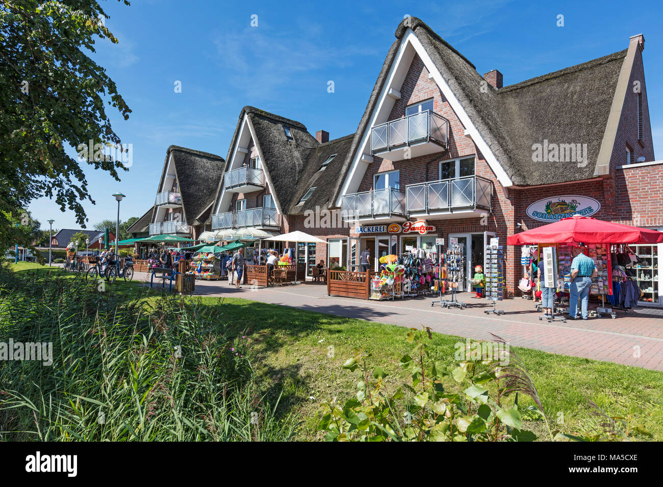 thatched-roof house, apartments, shops, beach avenue, Burhave ...