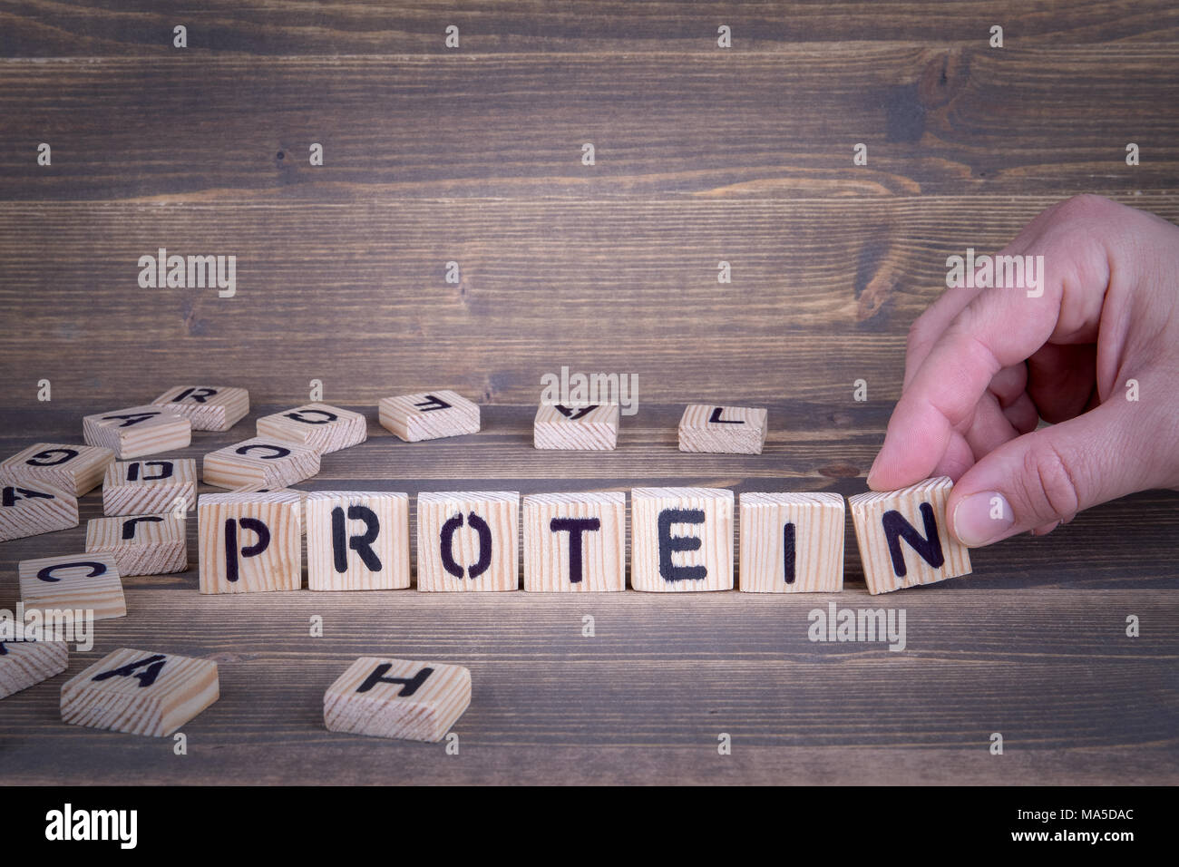 Protein. Wooden letters on the office desk, informative and ...