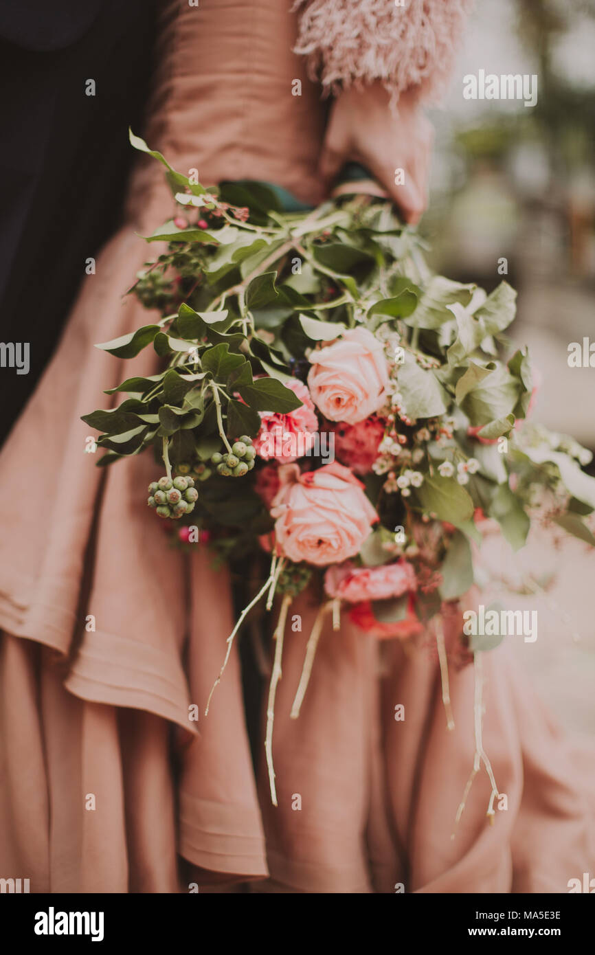 Bridal couple with flower bouquet, detail Stock Photo - Alamy