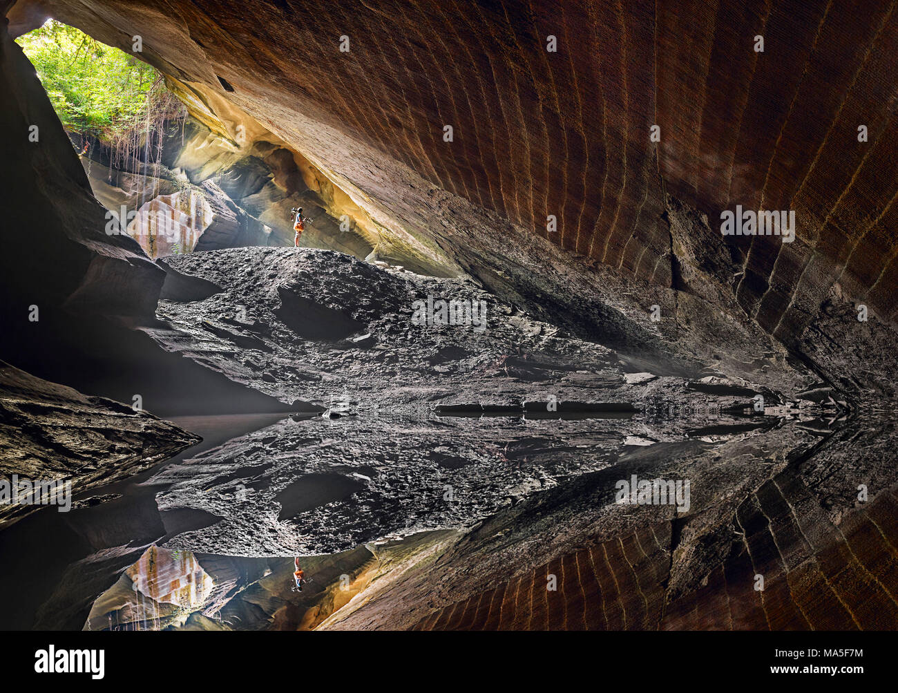 One man inside a cave of molera stone hi-res stock photography and ...