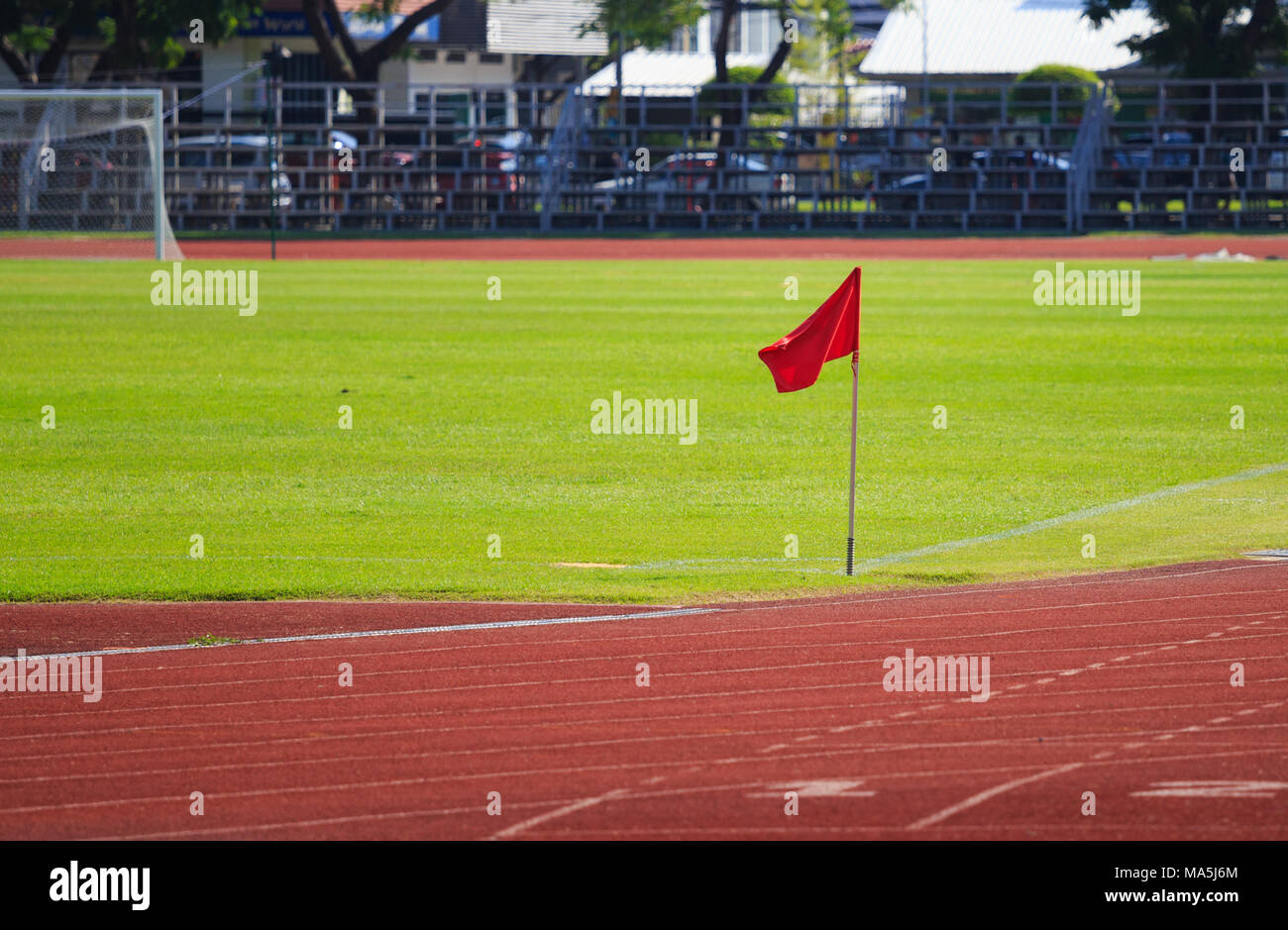 red flag at one corner of football field Stock Photo - Alamy