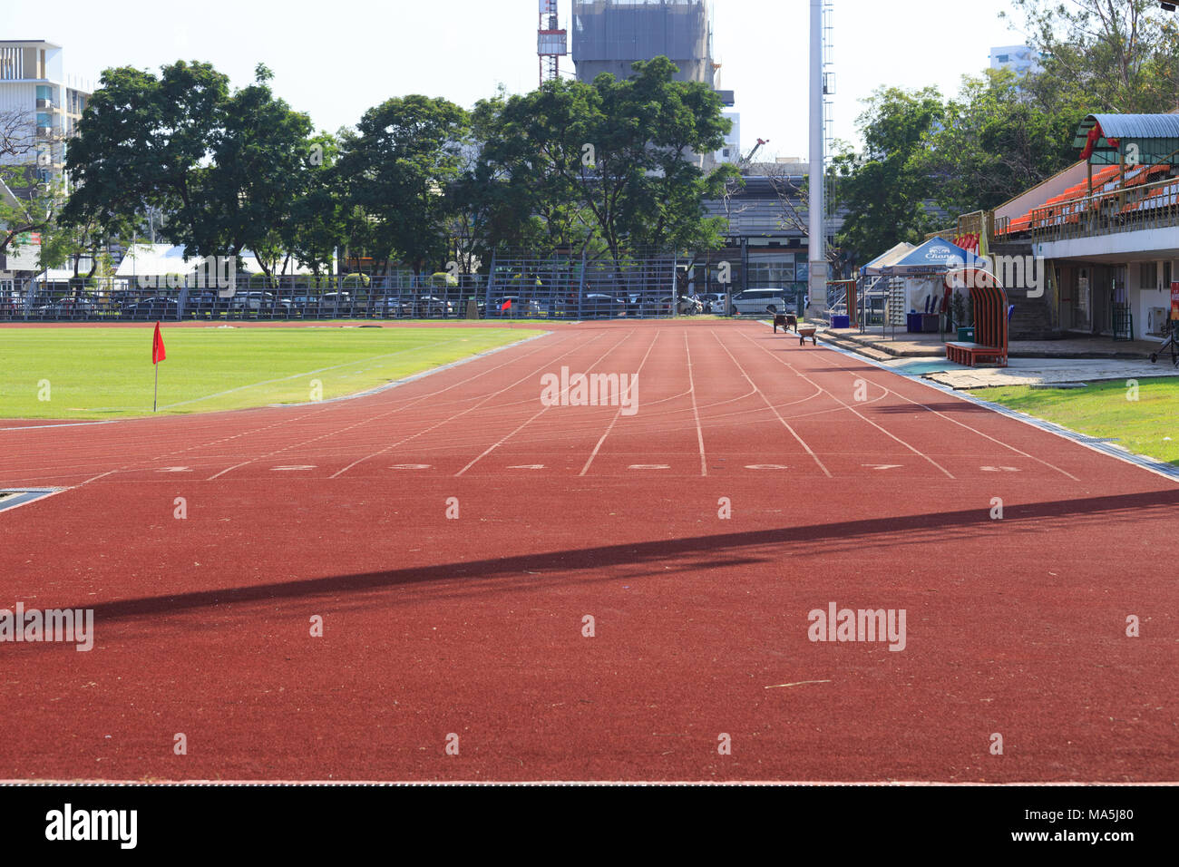 outdoor red running track with football field Stock Photo - Alamy