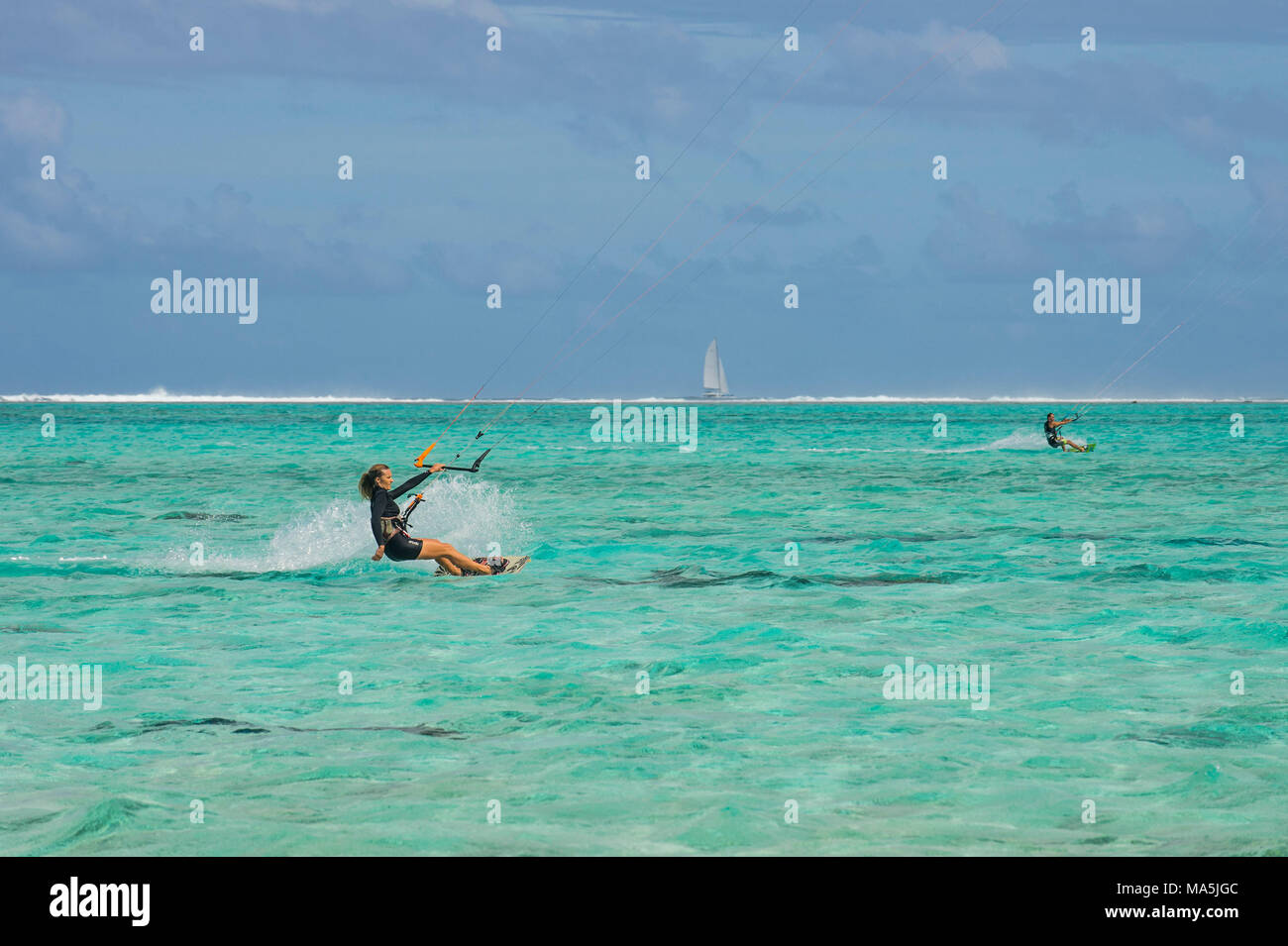 Kitesurfer in the turquoise lagoon of Bora Bora, French Polynesia Stock ...