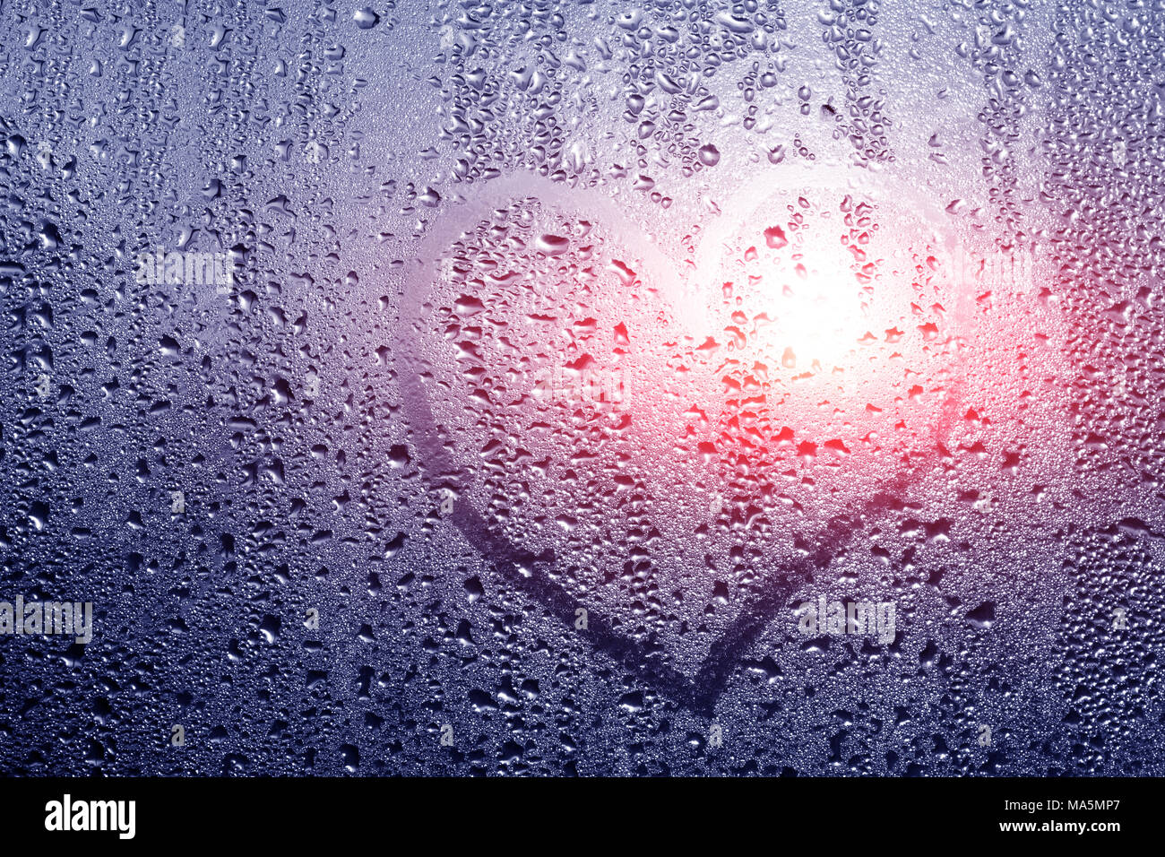 image of a heart and a question mark on a wet misted window. Emotion of ...
