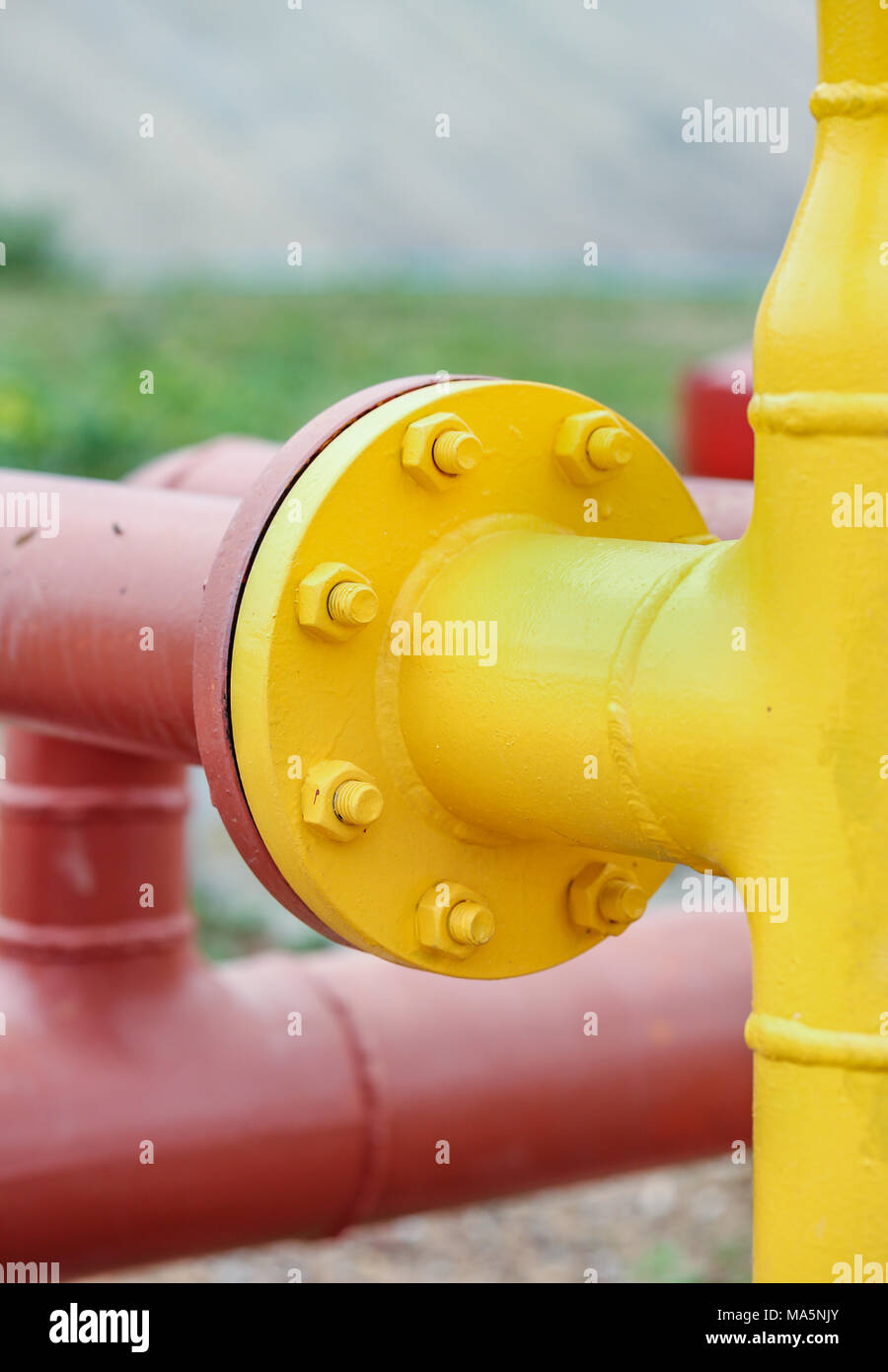 Close up yellow piping connection of red iron fuel tube Stock Photo - Alamy