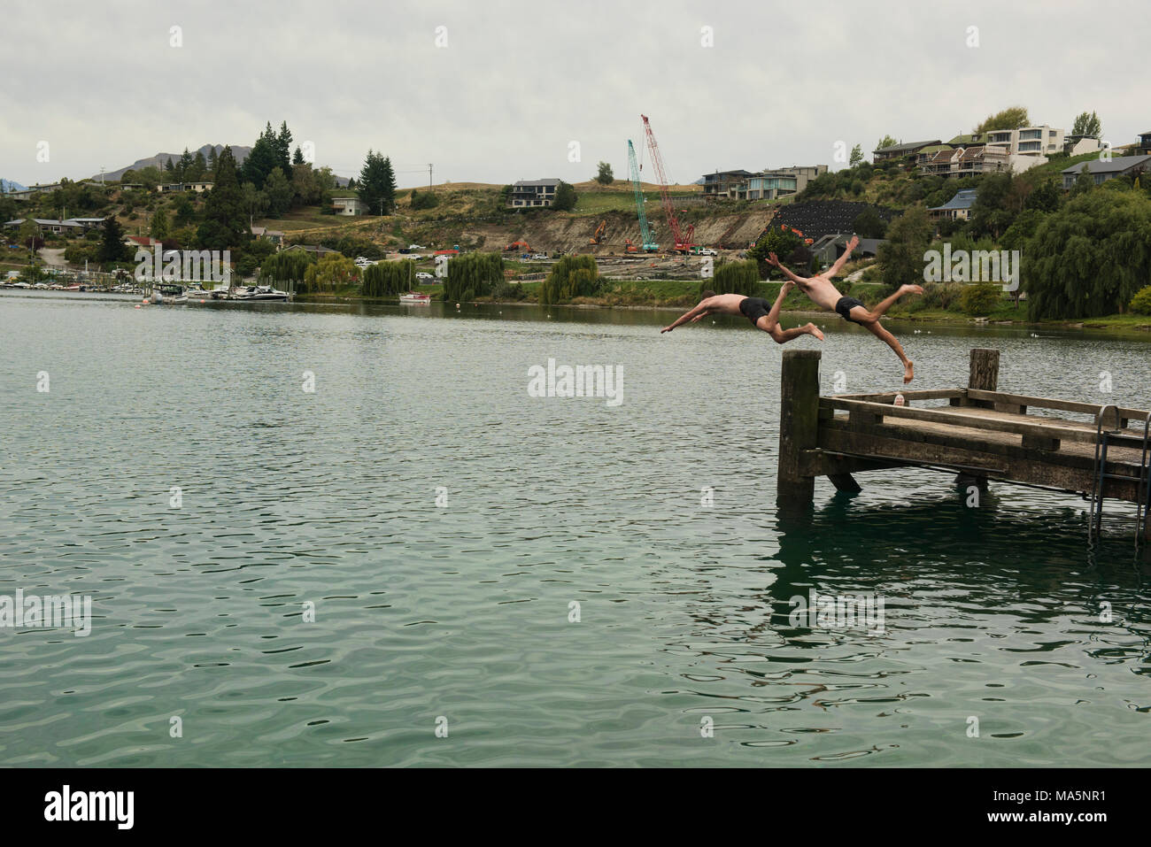 Boy diving into lake hi-res stock photography and images - Alamy