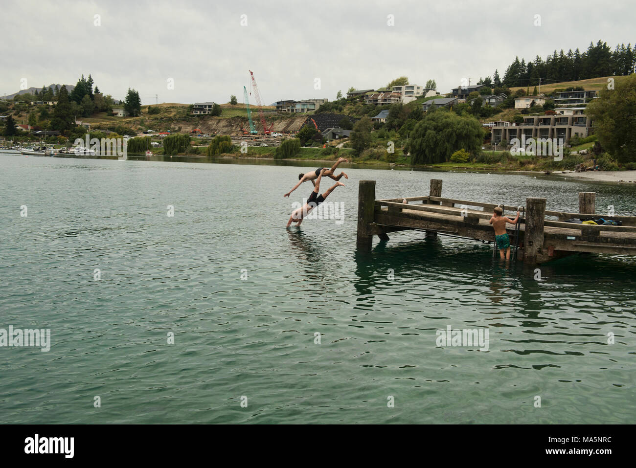 Boy diving into lake hi-res stock photography and images - Alamy