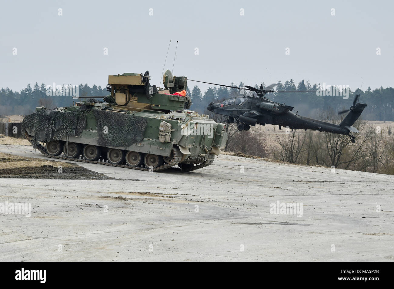 A Bradley Fighting Vehicle, left, with 5th Squadron, 4th Cavalry ...