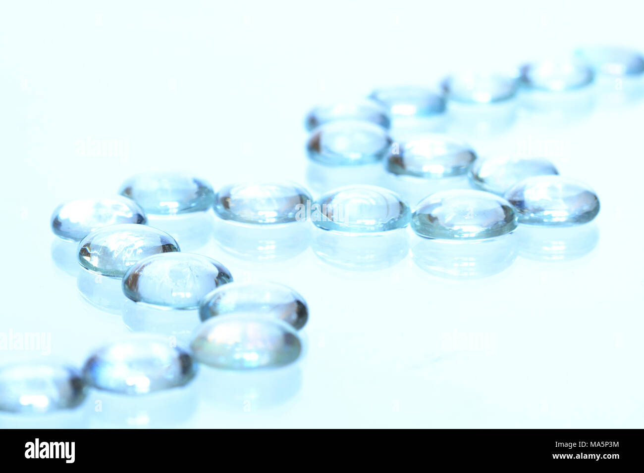 Abstract light blue background made from row of glass balls with ...