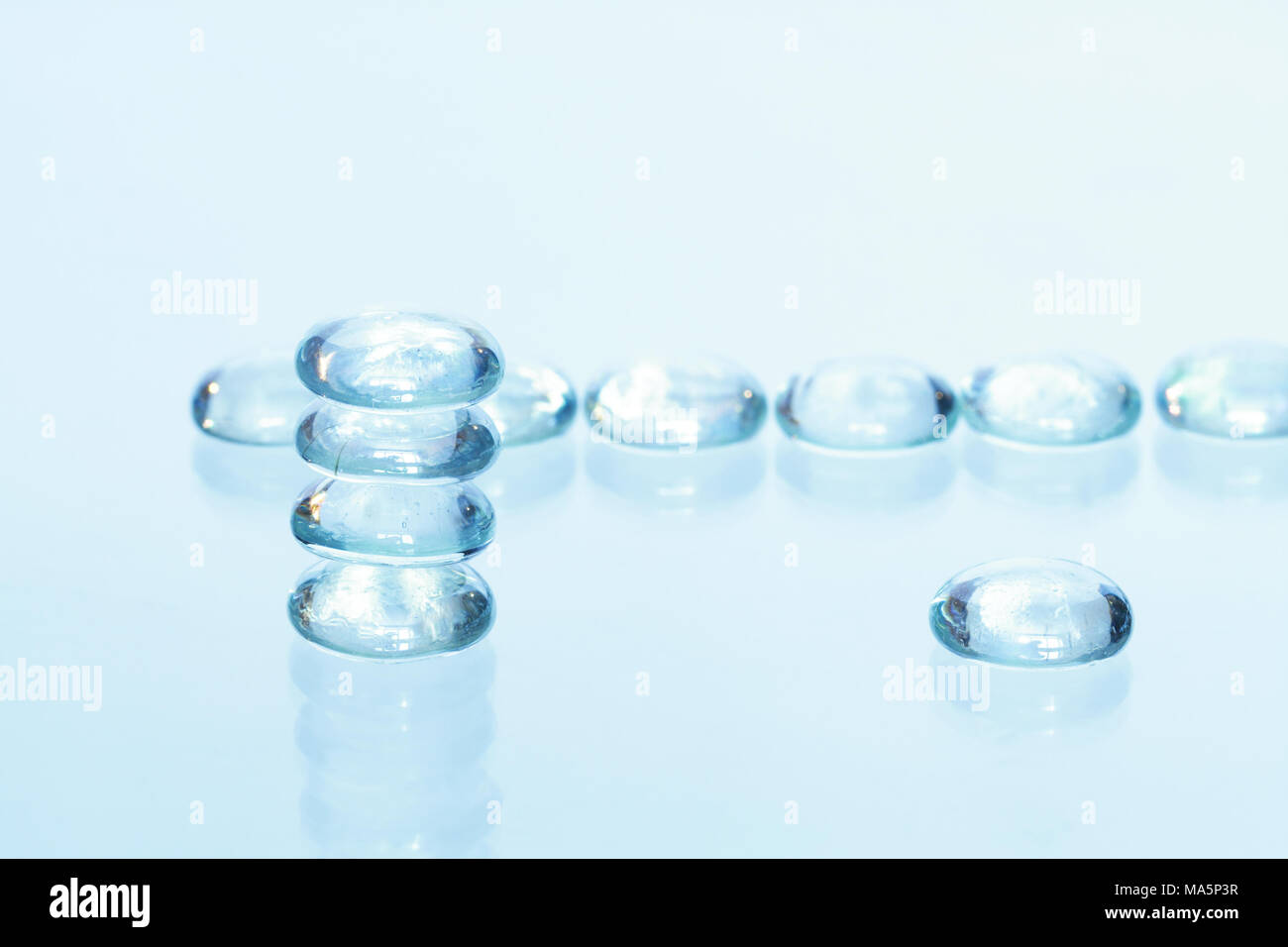 Abstract blue background made from row of glass balls with ...