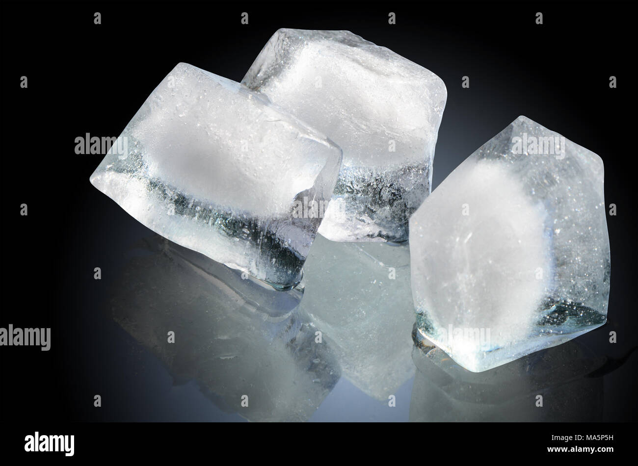 Three ice cubes isolated on dark background with clipping path Stock ...