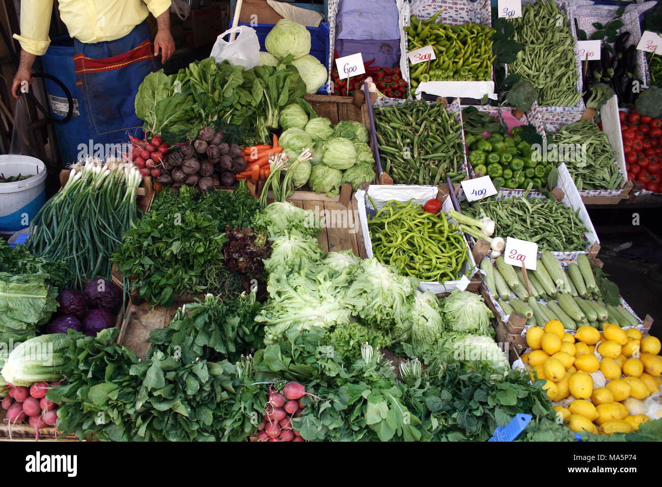 Street market vegetables. Fresh assortment of produce stacked in a row ...