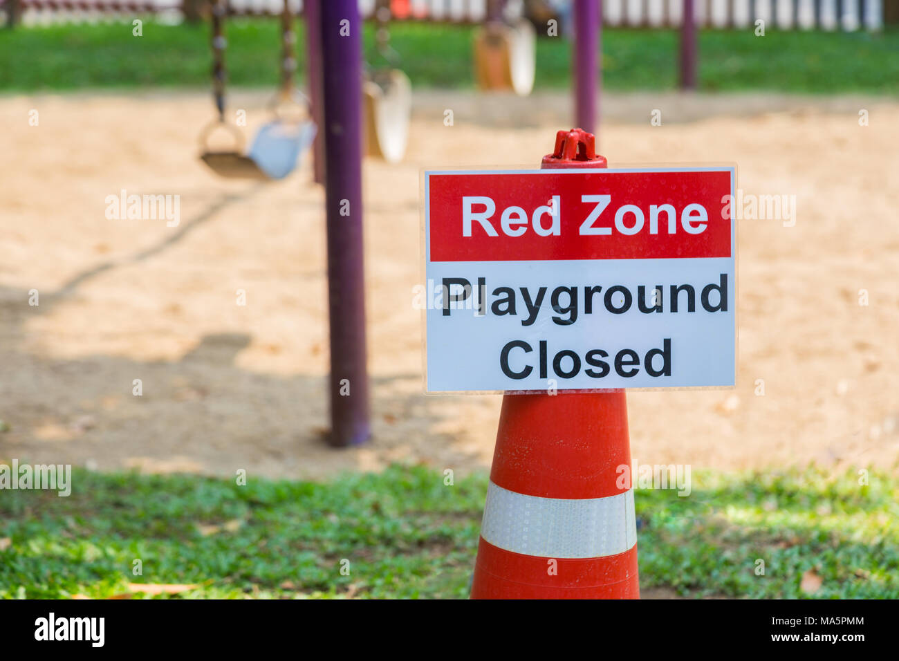 Red Zone Playground Closed sign posting at a children playground during ...