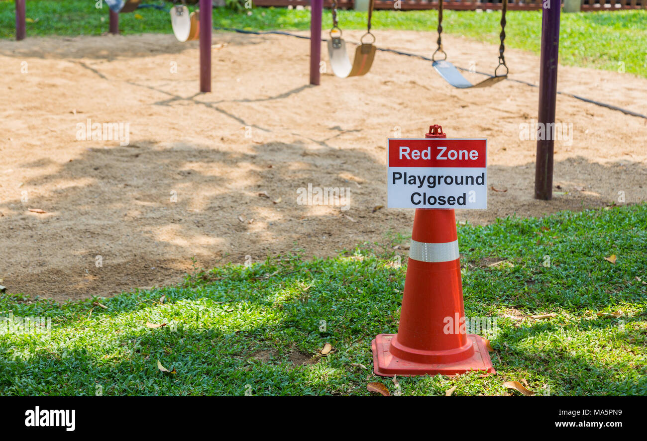 Red Zone Playground Closed sign posting at a children playground during ...