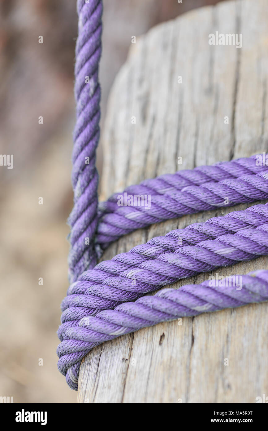 Old rope tied wooden pole hi-res stock photography and images - Alamy