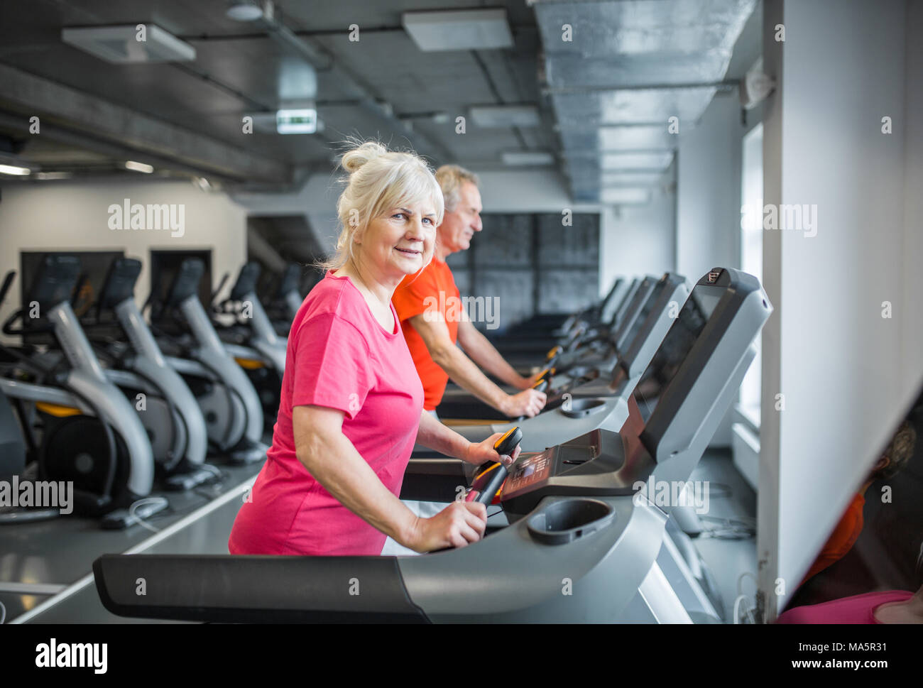 Mature woman walking on treadmill hi-res stock photography and images ...