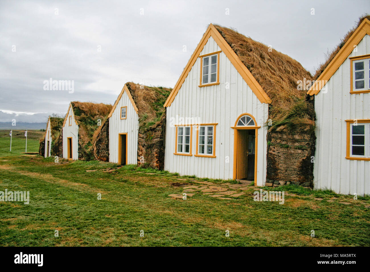 Traditional turf houses in a row in Iceland Stock Photo - Alamy