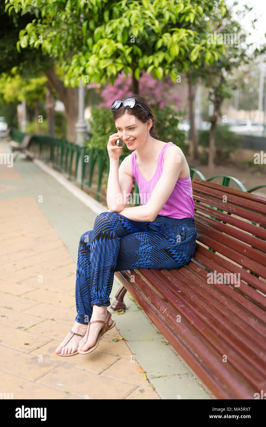 young lady on a bench Stock Photo - Alamy