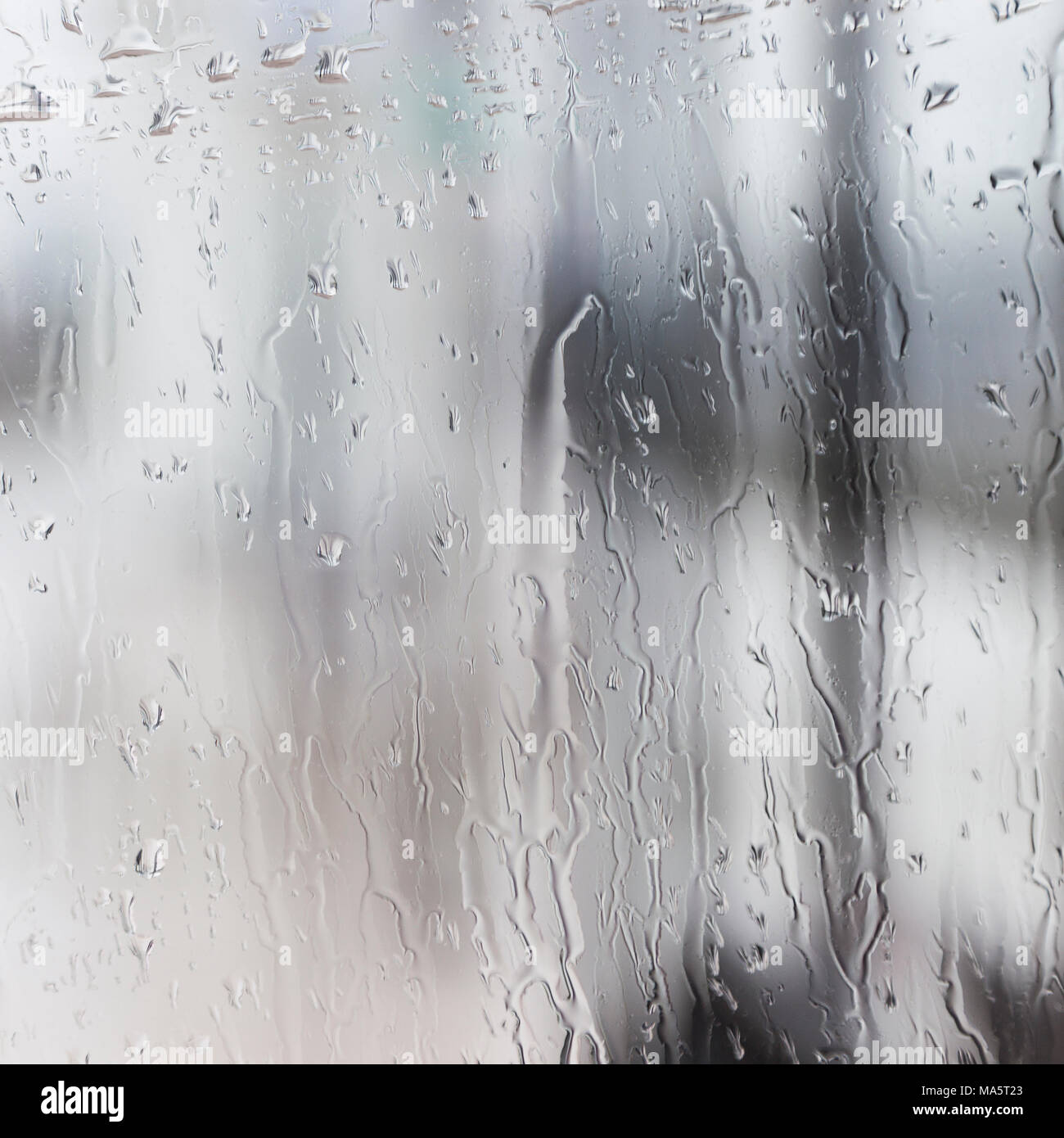 pouring rain on very wet glass pane Stock Photo - Alamy