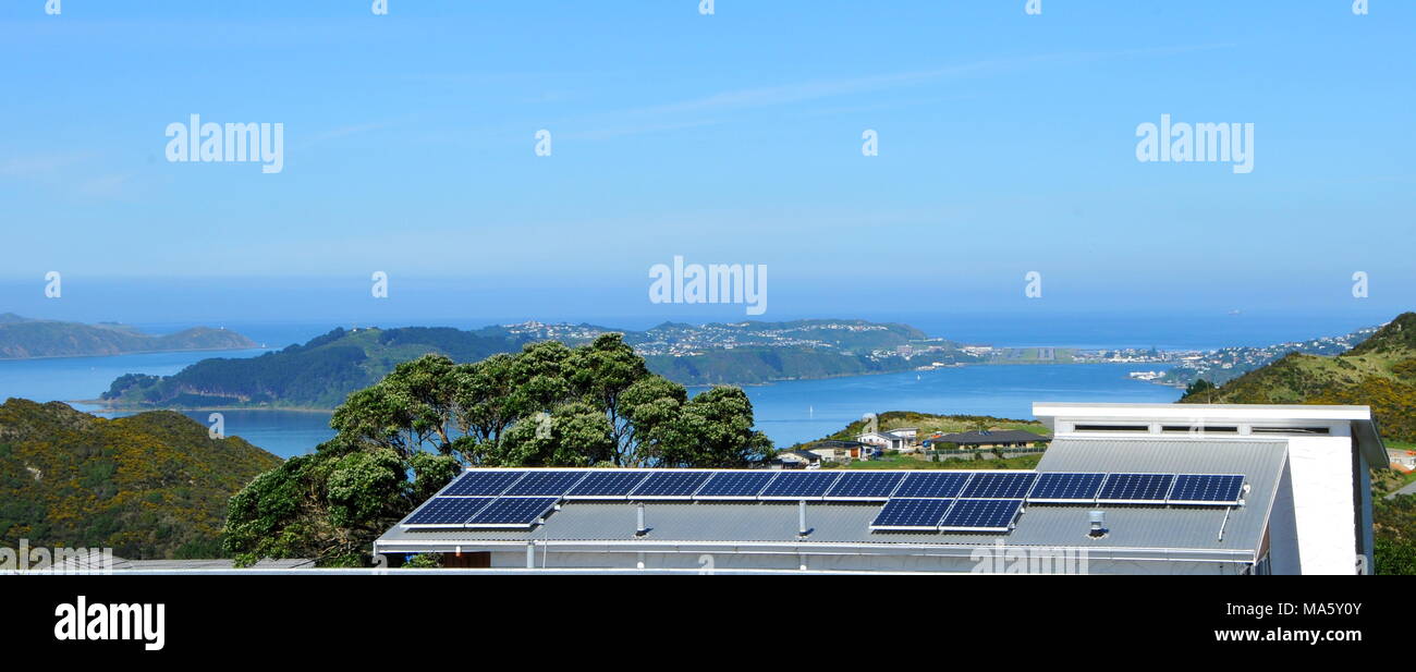 Rooftop solar panels facing north. Wellington Harbour and airport ...