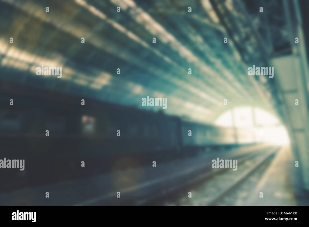 Blurred perspective view of a platform with outdated train, vintage ...