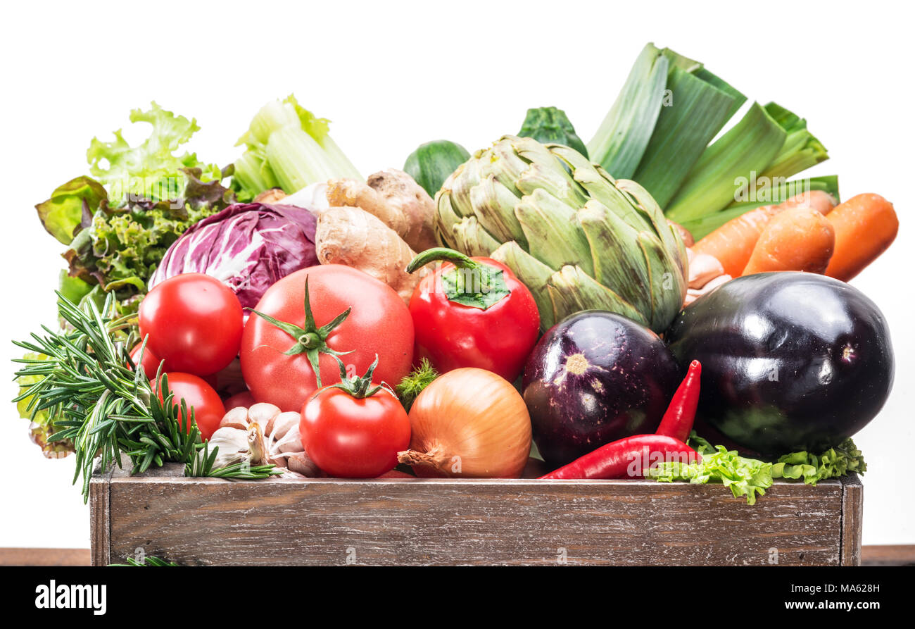Fresh multi-colored vegetables in wooden crate Stock Photo - Alamy